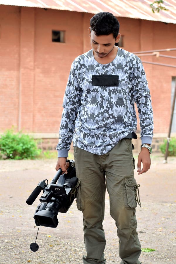 Cameraman Using A Professional Camcorder Outdoor Filming Documentary ...