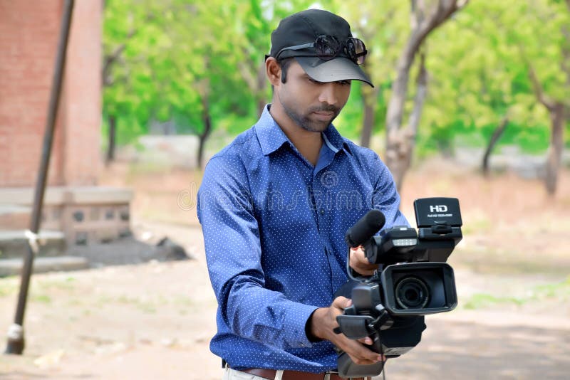 Cameraman Using a Professional Camcorder Outdoor Stock Image - Image of ...