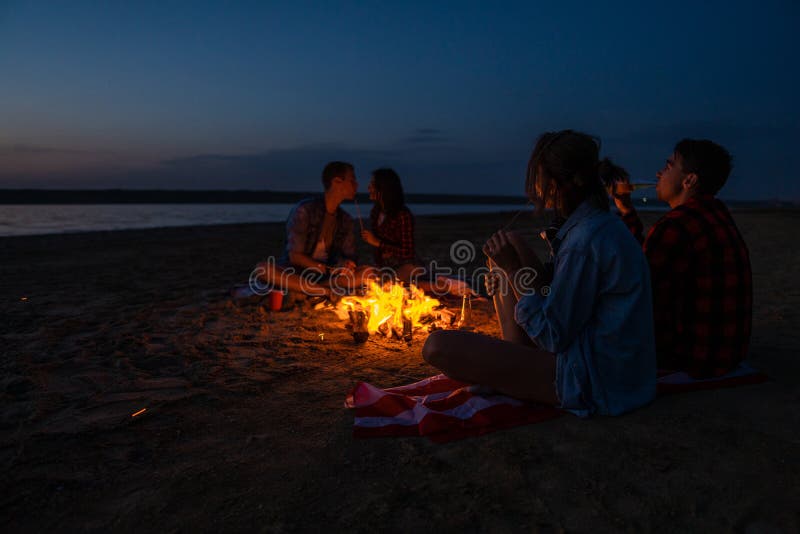 Young Friends Have Picnic with Bonfire on the Beach Stock Image - Image ...