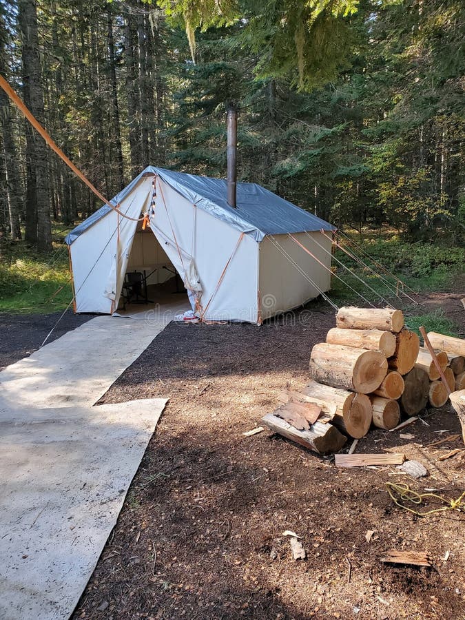 Camp Canvas Tent and Wood Pile. Stock Image - Image of canvas, roof ...