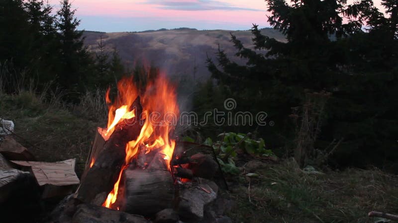 Camp Fire with Mountain Landscape in Background Stock Video - Video of ...