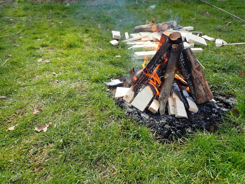 Camp Fire Started on a Green Meadow Stock Photo - Image of illumination ...