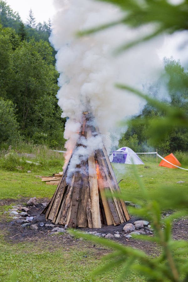 An Outside Fire in a Camping Base Stock Image - Image of smoke, place ...