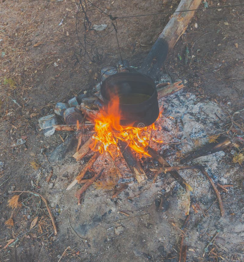 In the Campaign Pot of Water Over the Fire. Stock Image - Image of ...