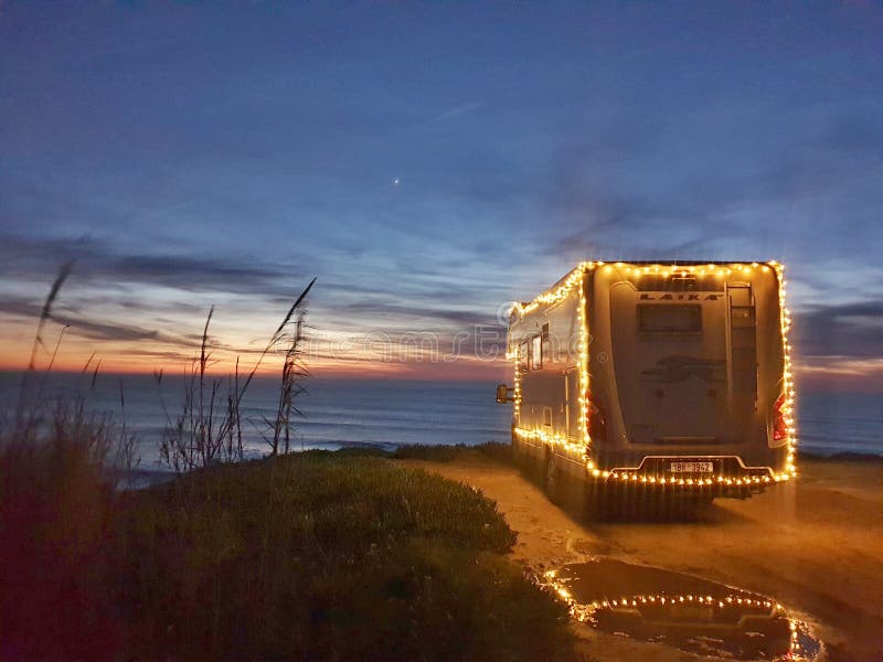 Camper on the Cliff Over the Ocean with Christmas Lights Stock Image ...
