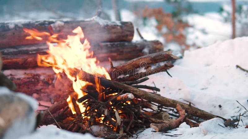 Campfire Burns in the Snow in the Forest Hill, on a Background of Snow ...