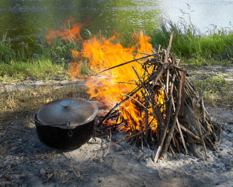 Campfire and Cauldron Near the River Stock Photo - Image of hike ...