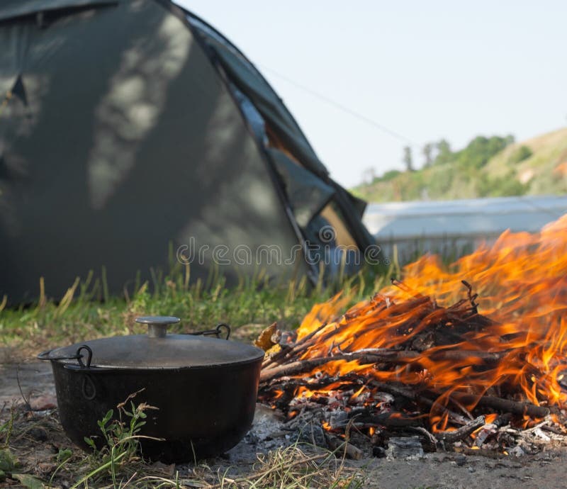 Campfire, Cauldron and Tent Near the River Stock Image - Image of meal ...