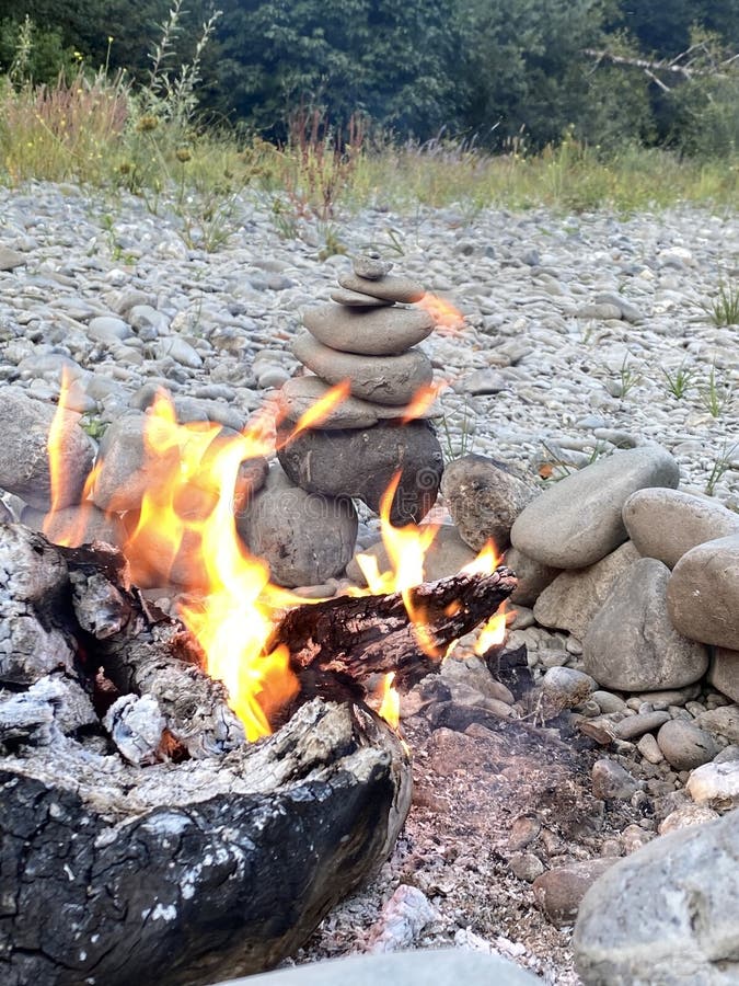 Campfire Chronicles: Flames Dance in a Rock-Made Firepit, Stacked ...