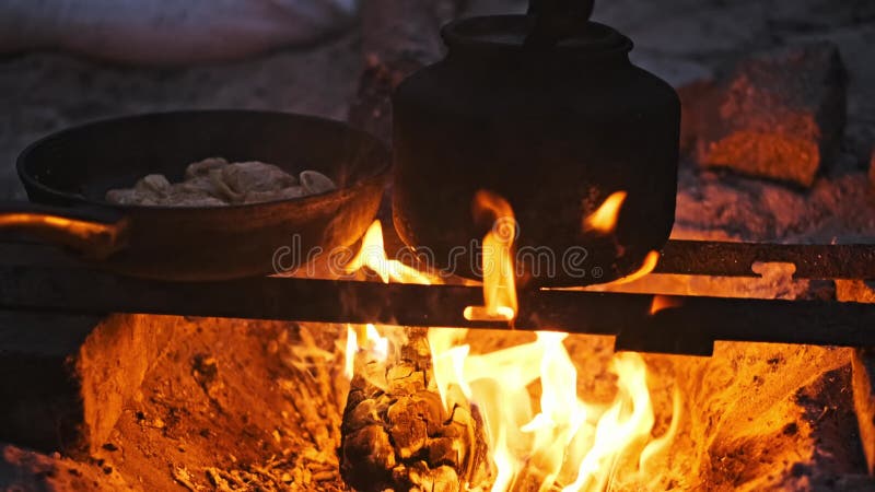 Campfire Cooking: Chicken Dinner and Boiling Kettle Stock Footage ...