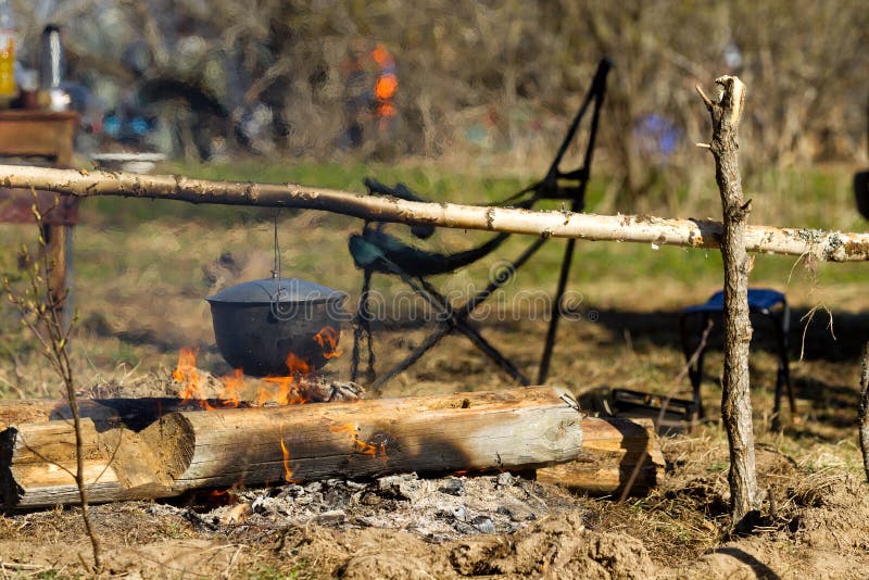 Campfire with a Cooking Pot Stock Photo - Image of light, burning ...
