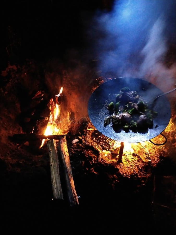 Campfire dinner stock image. Image of preparing, campfire - 112238533