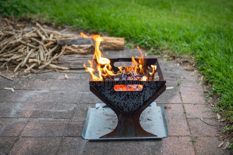 Campfire, Fire Pit Filled with Burnt Wood and Flames. Chopped Fire Wood ...