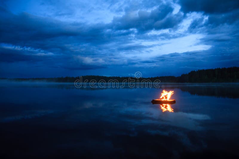 Campfire on the lake stock image. Image of floating, forest - 49500497