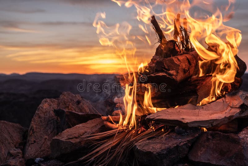 A Campfire Lit on the Top of a Mountain with the Desert As a Backdrop ...
