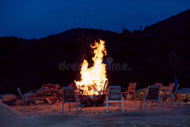 Campfire at Night with Empty Chairs Stock Photo - Image of station ...