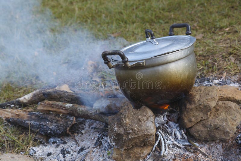 Campfire pot boiling stock photo. Image of burn, iron - 29304220
