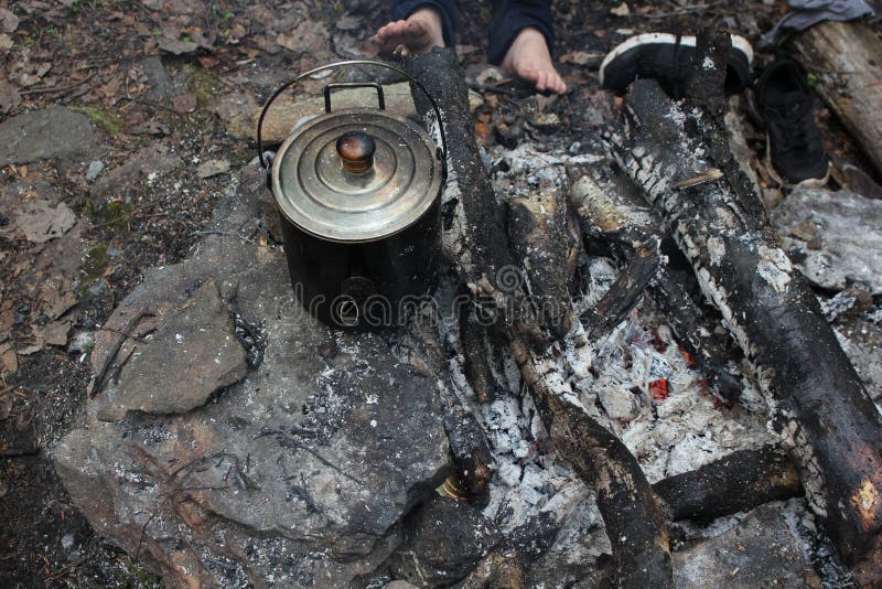 Campfire in the Wild Forest. Smoked Kettle Boiling on a Fire Â Stock ...