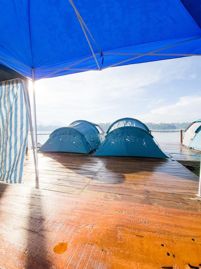 Camping in a Blue Tent on a Wooden Floor Stock Photo - Image of ...