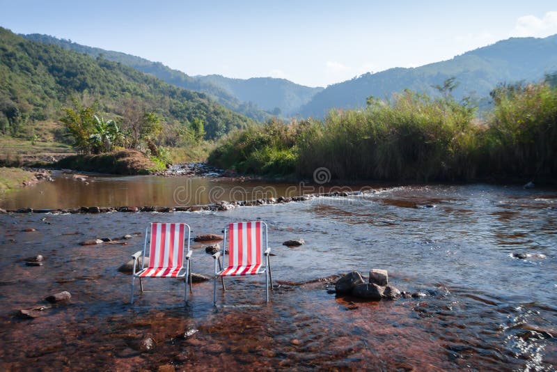 Camping Chairs in the River Stock Image - Image of green, stone: 247971499