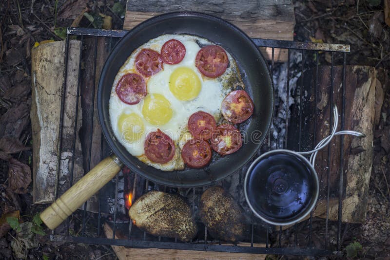 Camping cooking breakfast. stock image. Image of backpack - 76085525