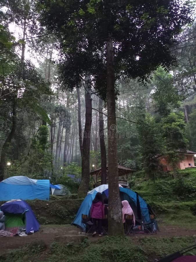 Camping with Family at Cilember Waterfall Stock Image - Image of person ...