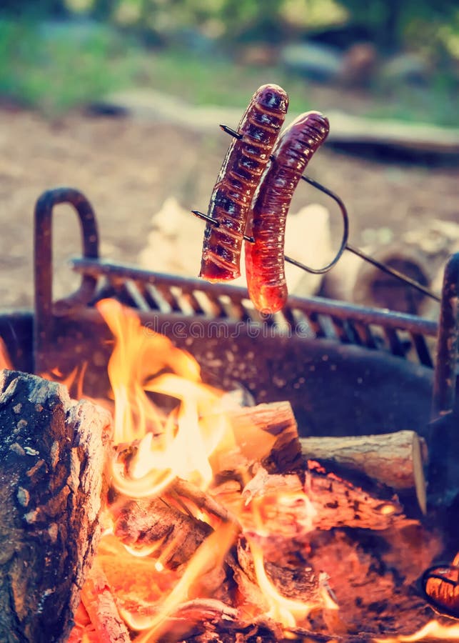 Preparing Sausages on Camp Fire Stock Image - Image of leisure, camping ...