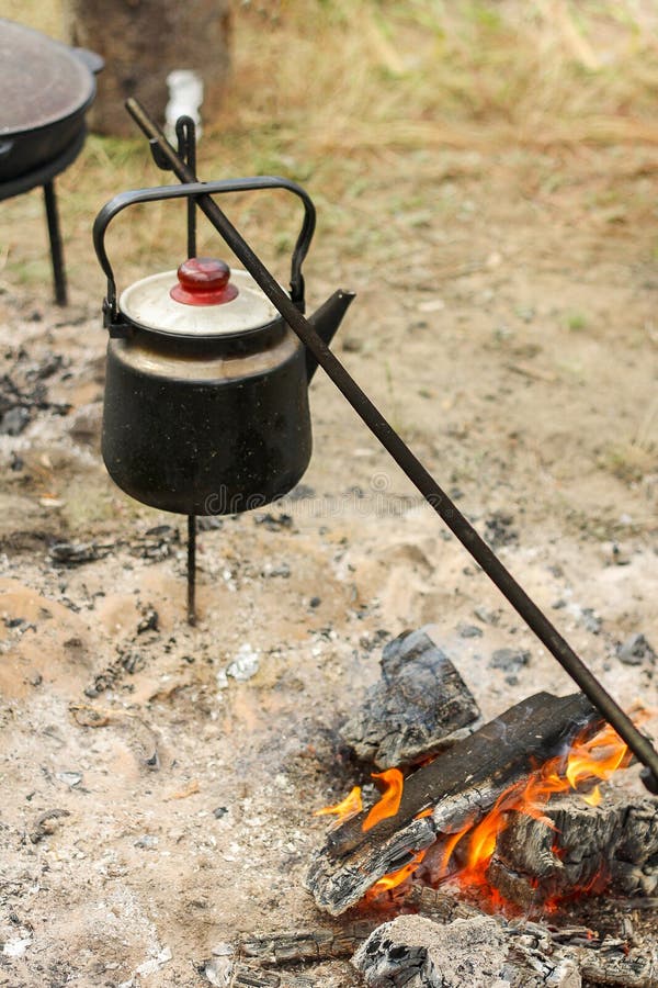 Camping in Nature after a Hike, Making Tea on the Fire Stock Photo ...