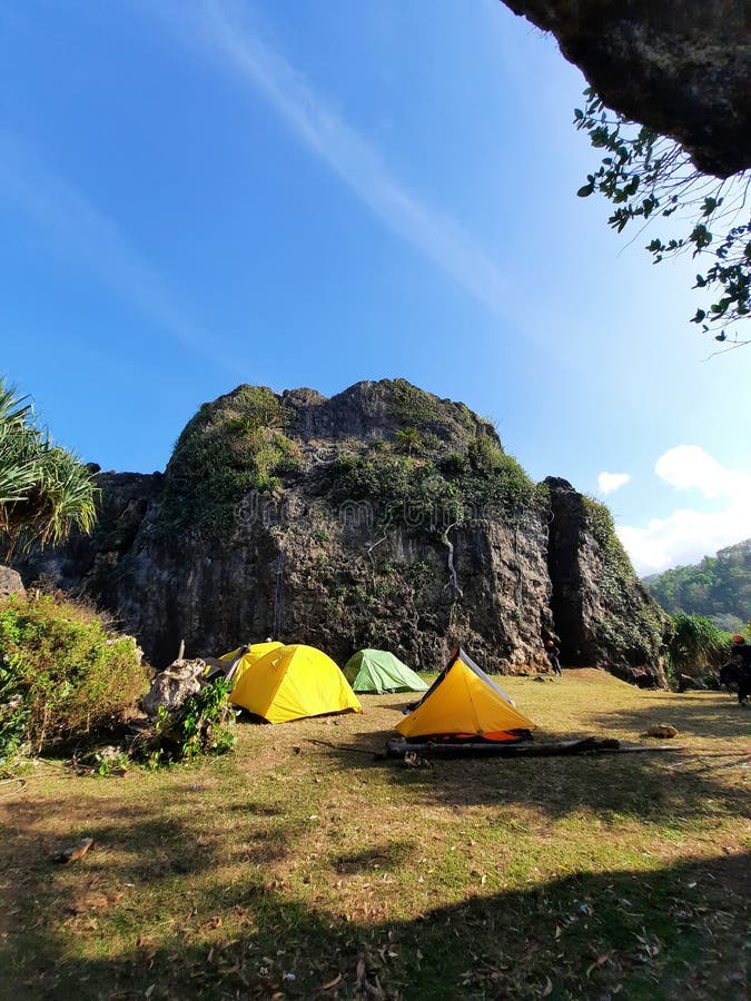 Camping Near Tropical Cliff Stock Photo - Image of rock, tree: 210098318