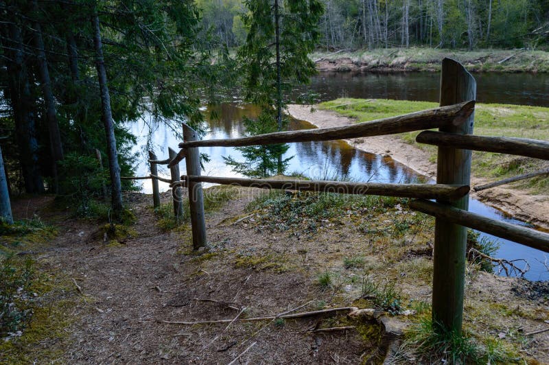 Camping and Resting Area by the River with Bench and Fireplace Stock ...