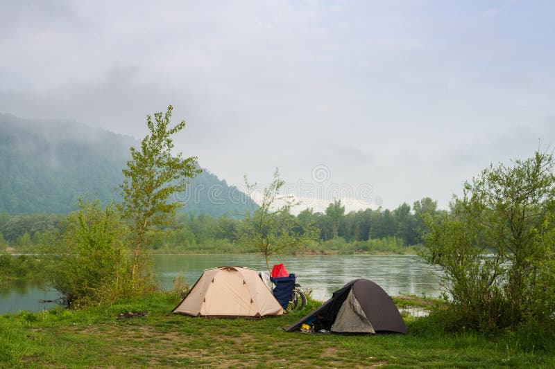 Camping by a river stock image. Image of lifestyle, vacation - 66741169
