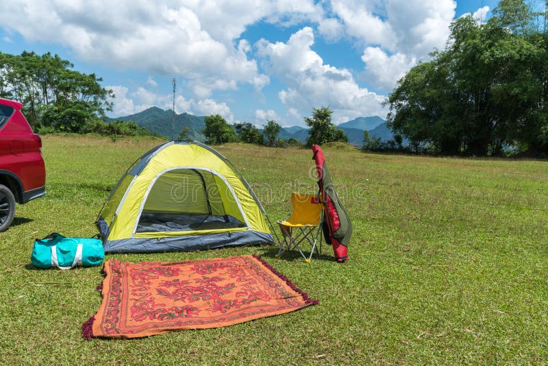 Camping Site on Grass Field with Tent and Car beside Tent. Leisure ...