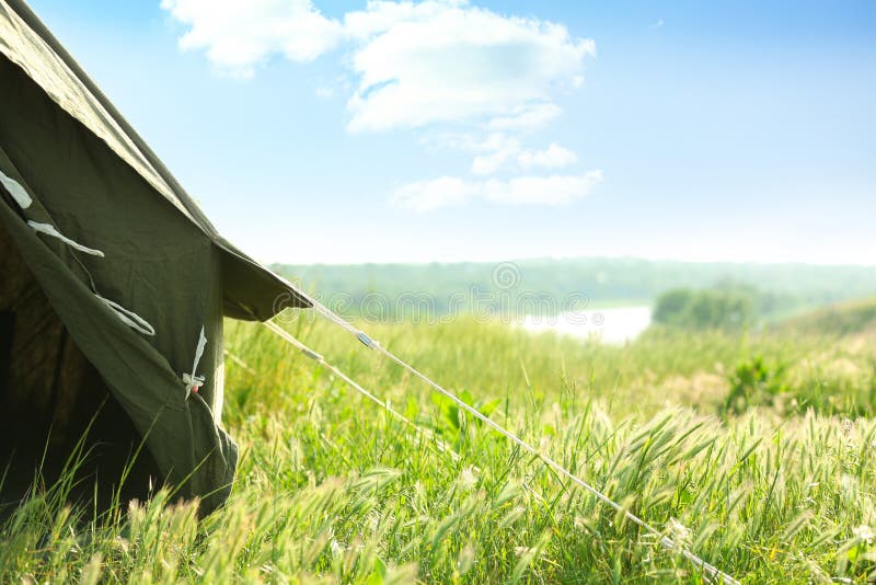 Camping Tent in Green Field on Sunny Day Stock Photo - Image of ...