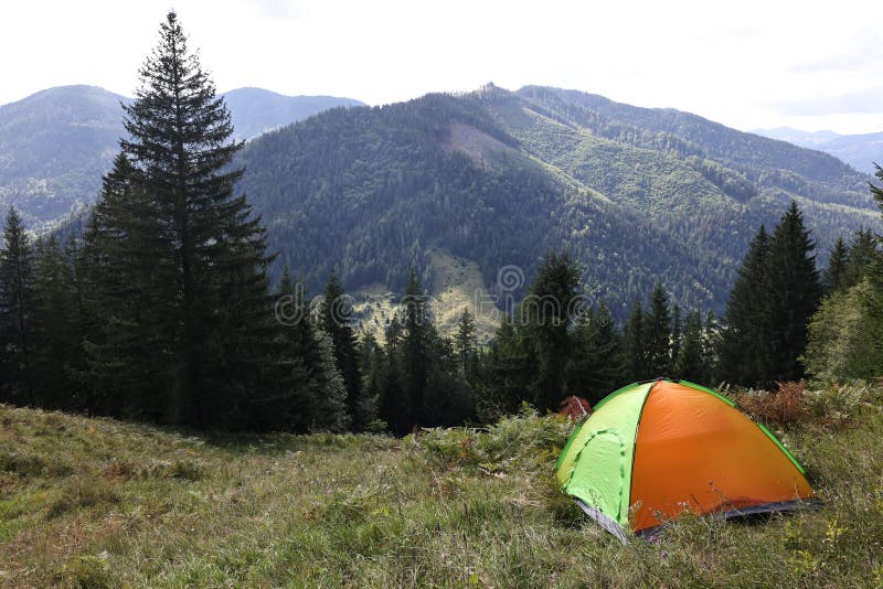 Camping Tent on Green Grass in Mountains Stock Photo - Image of ground ...