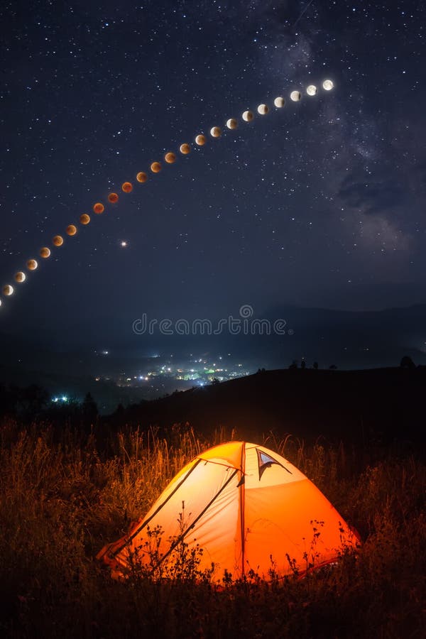 Camping Tent in a Mountain Valley with Total Moon Eclipse Track Stock ...