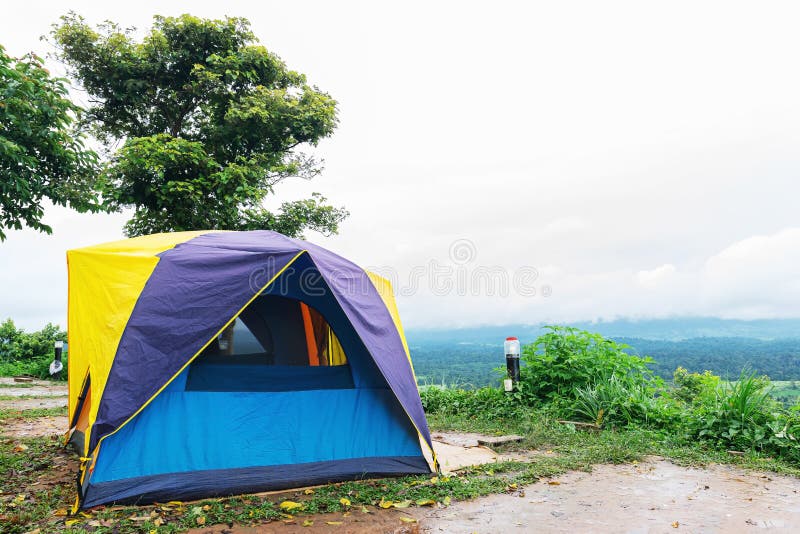 Camping Tent that is Set Up at the Highest Point of a High Mountain ...