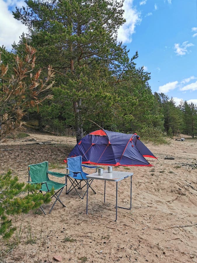Camping with a Tent, Table and Chairs on the Sandy Beach. Relaxation in ...