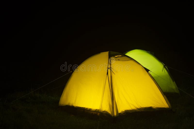 Camping Tents at Night in Nature Glow Inside Stock Photo - Image of ...