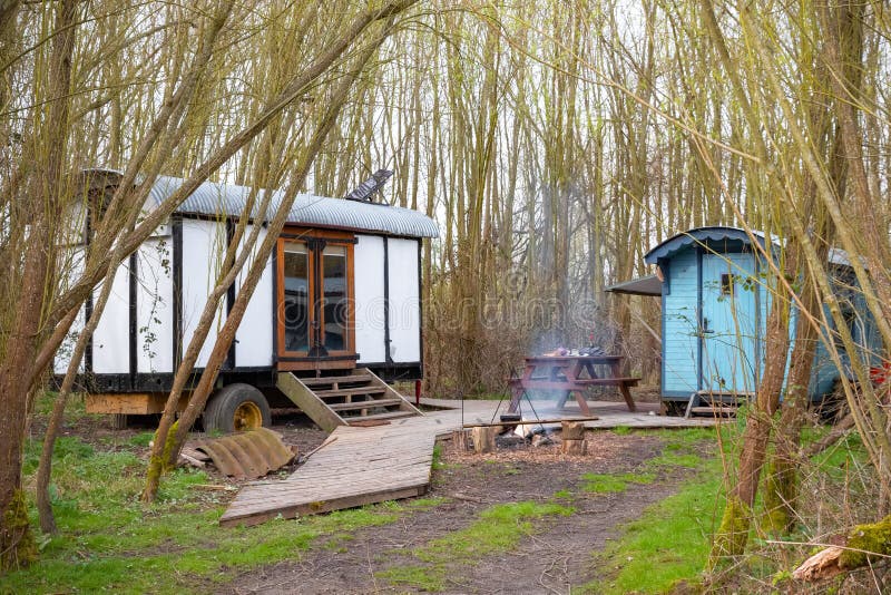 Camping in a Wood with Converted Train Carriages in England Stock Photo ...