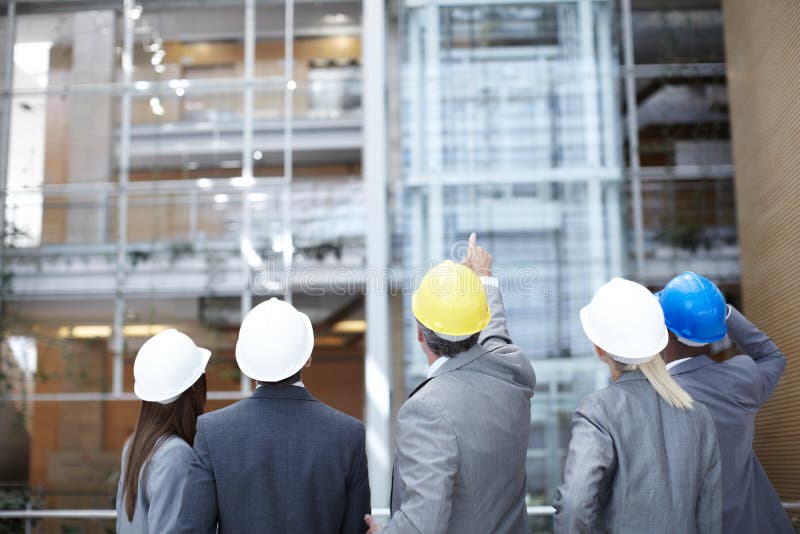 Can that Be Improved. a Rearview Shot of a Diverse Group of Engineering ...