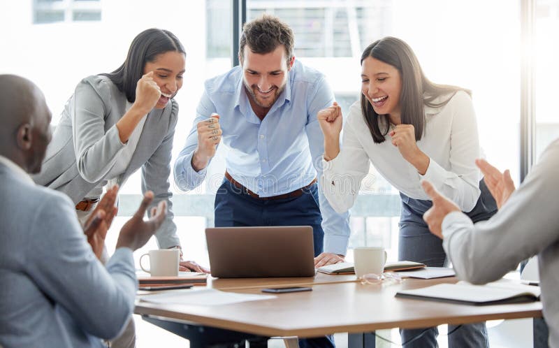 We Can Do this. Shot of a Group of Businesspeople Cheering while Using ...