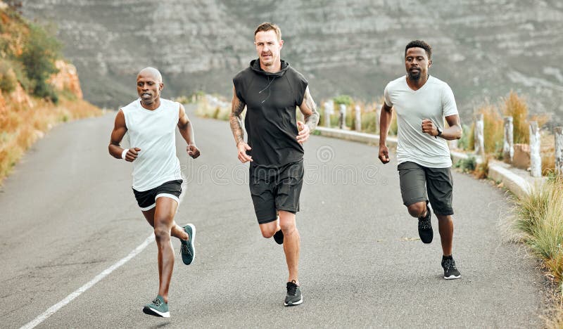 We Can Do this. Shot of a Group of Men Exercising in Nature. Stock ...
