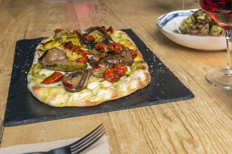 We Can Enjoy an Authentic Italian Pizza, with a Thin Crispy Crust and a ...