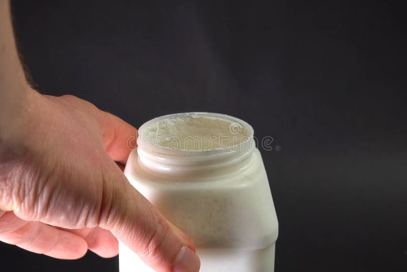 Can of Protein, a Bodybuilder Takes a Can of Protein Stock Image ...