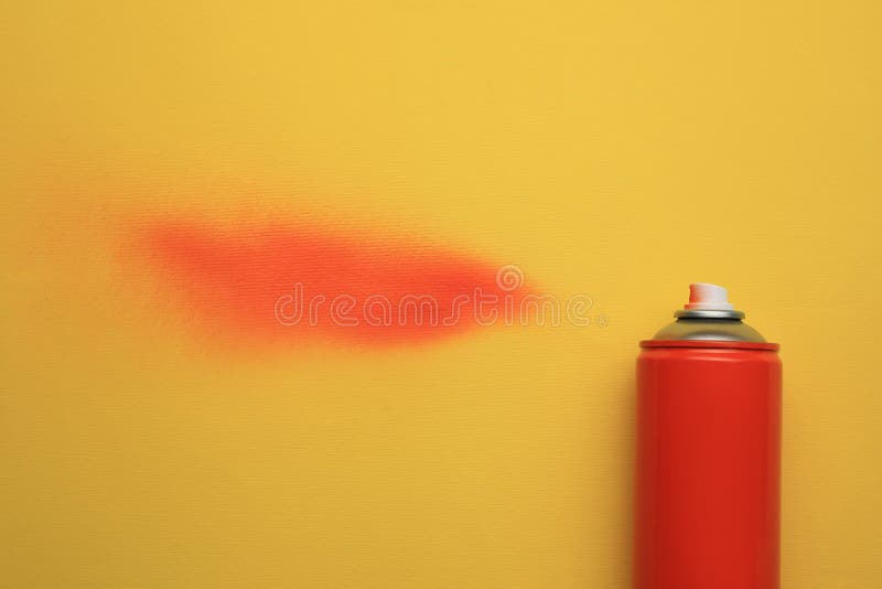 Can of Red Graffiti Paint and Sprayed Dye Sample on Yellow Background ...