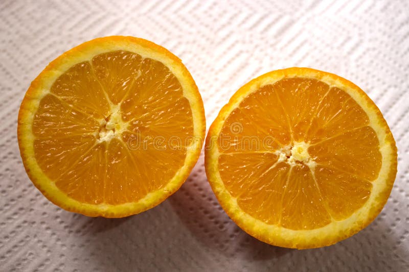 A Halved Orange on a Napkin Stock Photo - Image of ripe, background ...