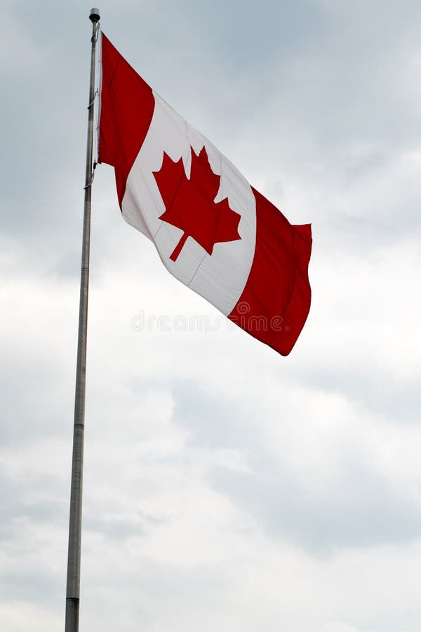 Canada Flag with Blue Sky and Clouds Stock Image - Image of waving ...