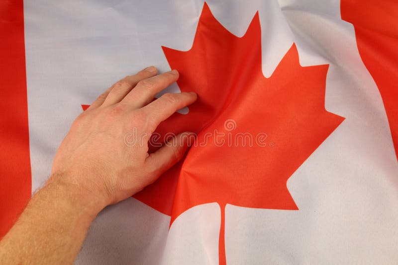Canada flag silk and hand stock image. Image of flag - 253572395