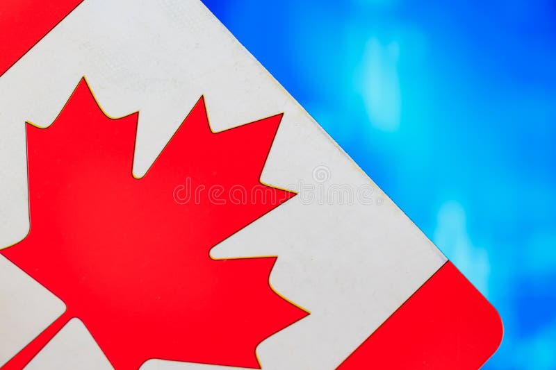 Canadian Flag with Red Maple Leaf on Bright Blue Background Stock Photo ...