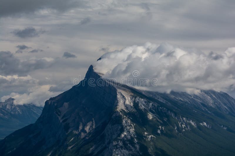 Canadian mountains, clouds stock image. Image of peaceful - 87832645